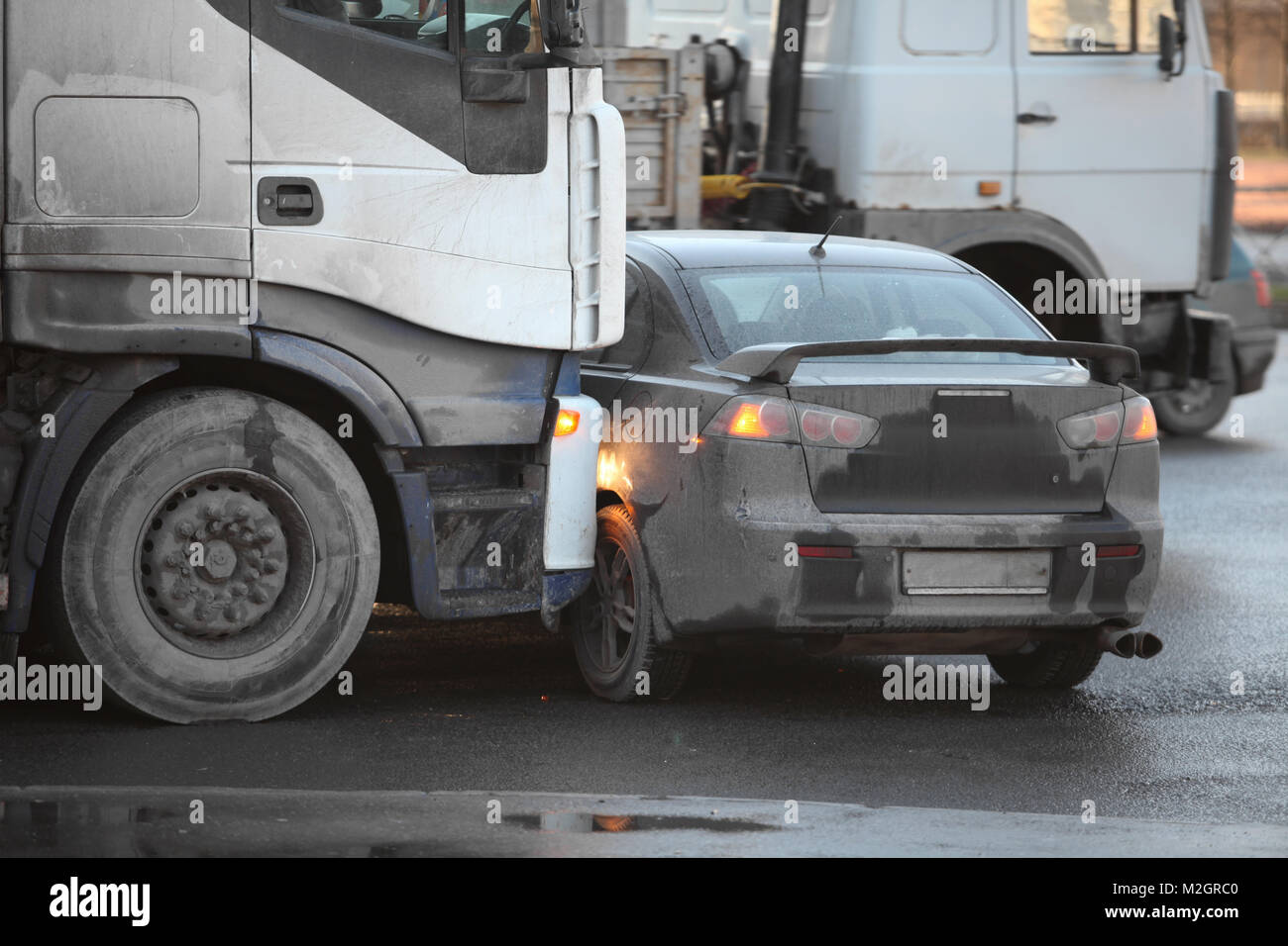 collision of the truck and car on a busy road side view Stock Photo - Alamy