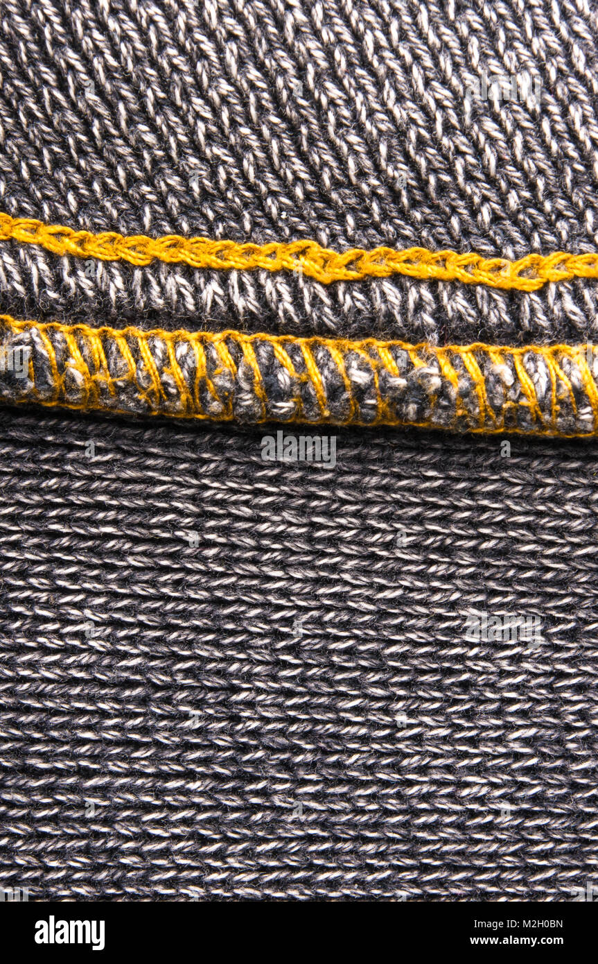 texture of a washed thick knit fabric, with decorative elements, seams ...