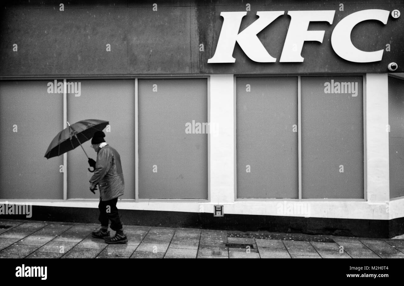 Fighting wind with umbrella Black and White Stock Photos & Images - Alamy