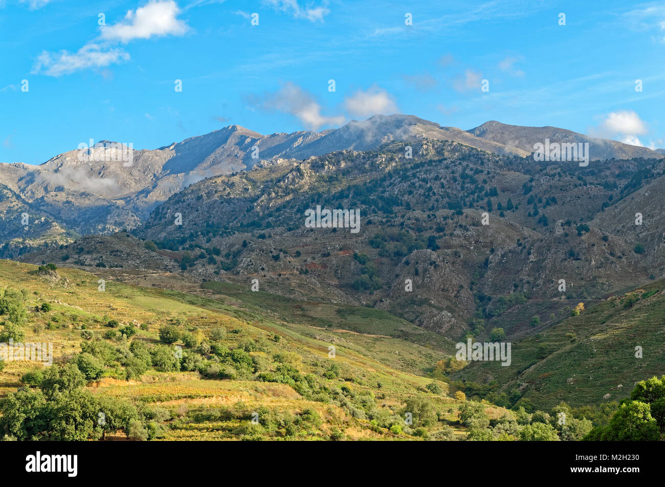 Mountains and meadows under blue sky on the island Grete, Greece Stock ...