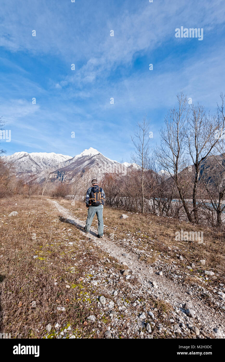 Man walking toward mountains hi-res stock photography and images - Alamy