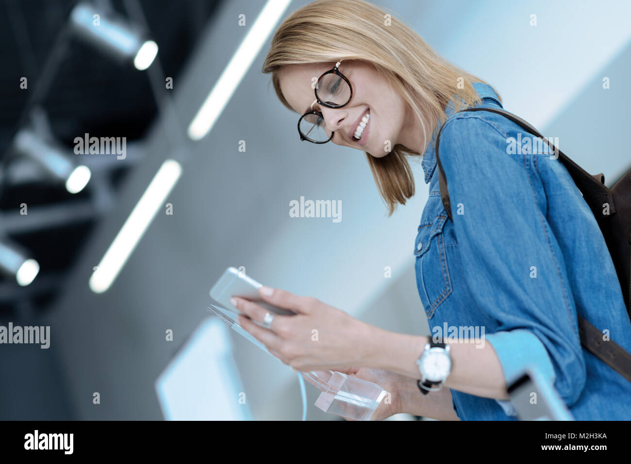 Glad smiling female customer hi-res stock photography and images - Alamy