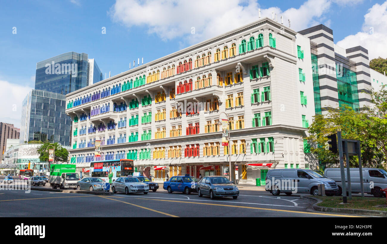 Morning traffic in front of the colourful Mica Building in Singapore ...