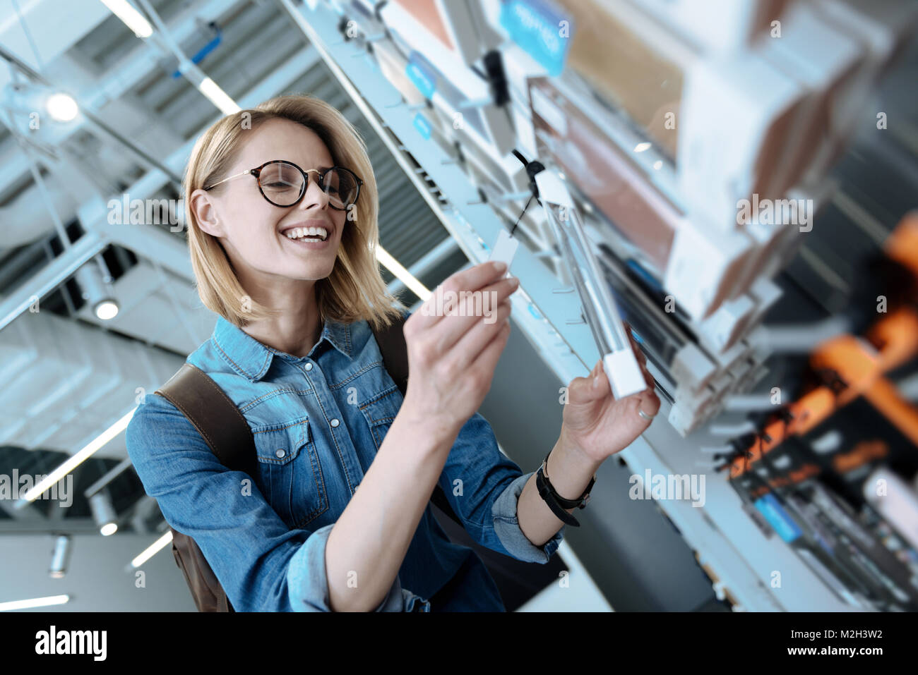 Low angle photo of attractive girl that showing smile Stock Photo - Alamy