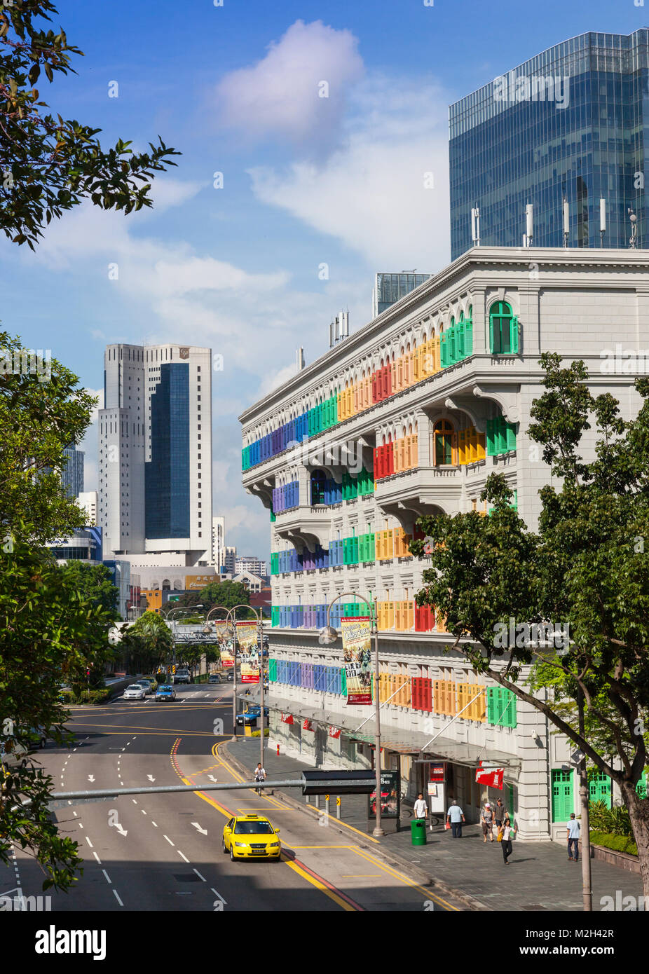 The colourful Mica Building in Singapore with modern skyscrapers in the ...