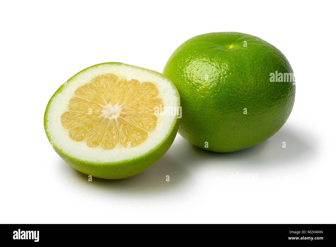 Whole and half oroblanco fruit isolated on white background Stock Photo ...