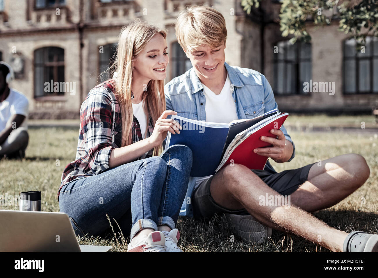 Positive nice student studying for an exam Stock Photo - Alamy
