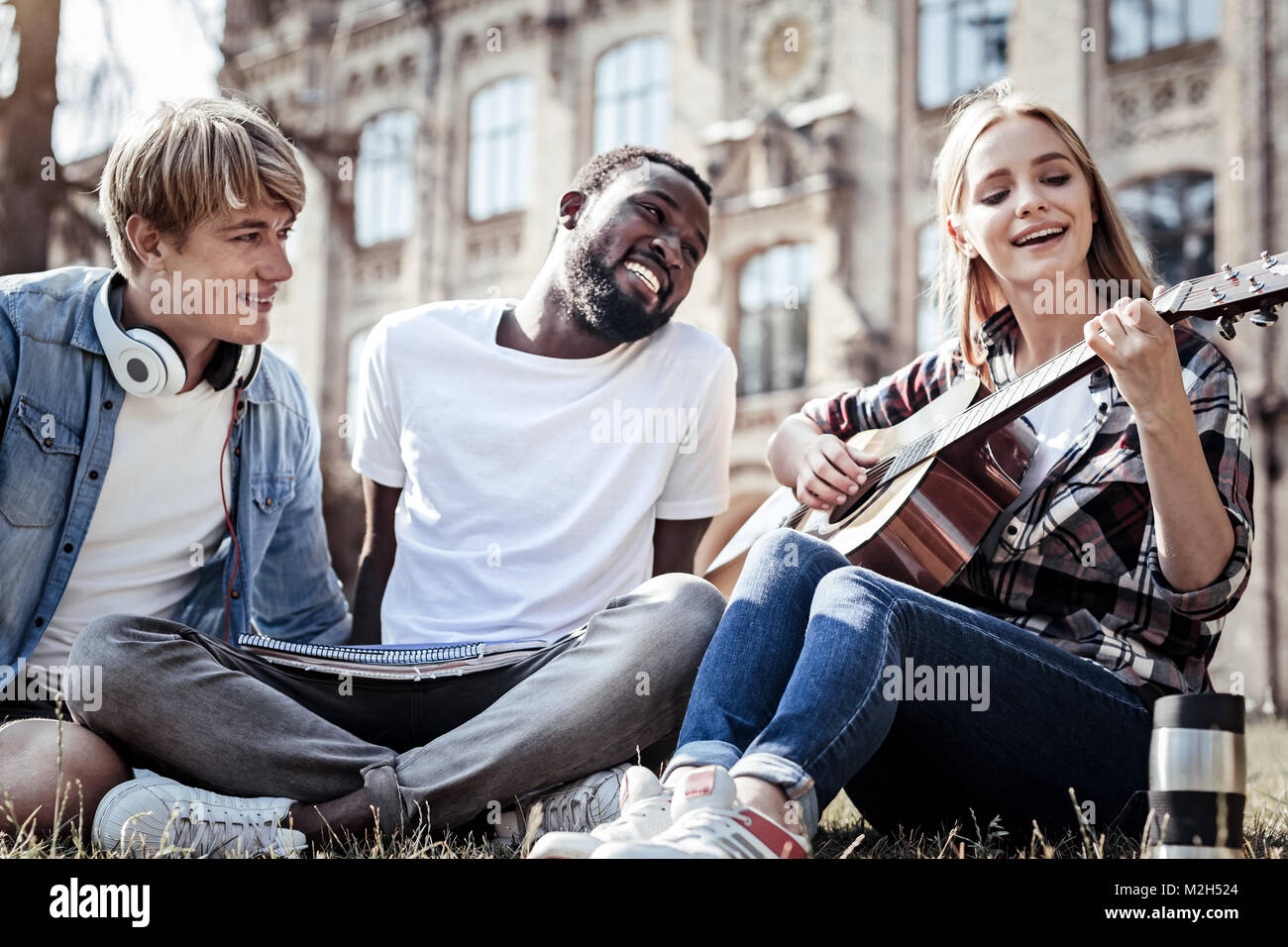 Happy joyful men listening to the song Stock Photo - Alamy