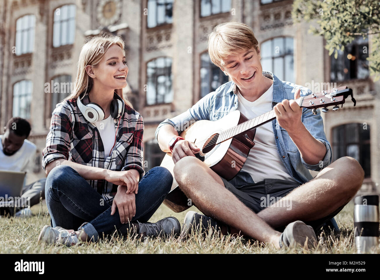 Delighted happy man playing music Stock Photo - Alamy