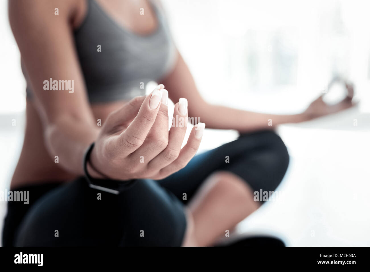Close up of young lady practicing yoga Stock Photo - Alamy