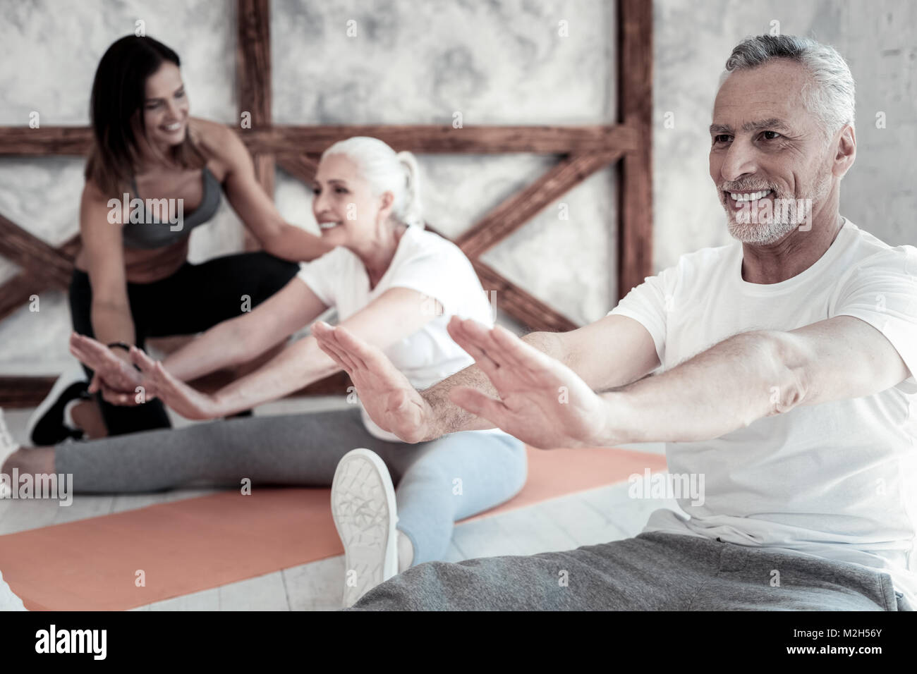Retired people enjoying sport session at fitness club Stock Photo - Alamy