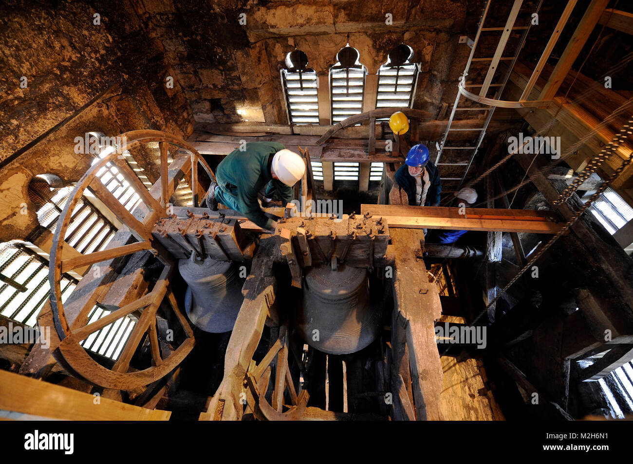 A team of volunteers remove church bells that have been in the bell ...