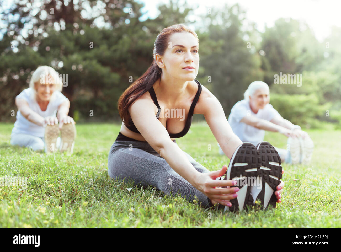Attractive well built woman developing her body Stock Photo - Alamy