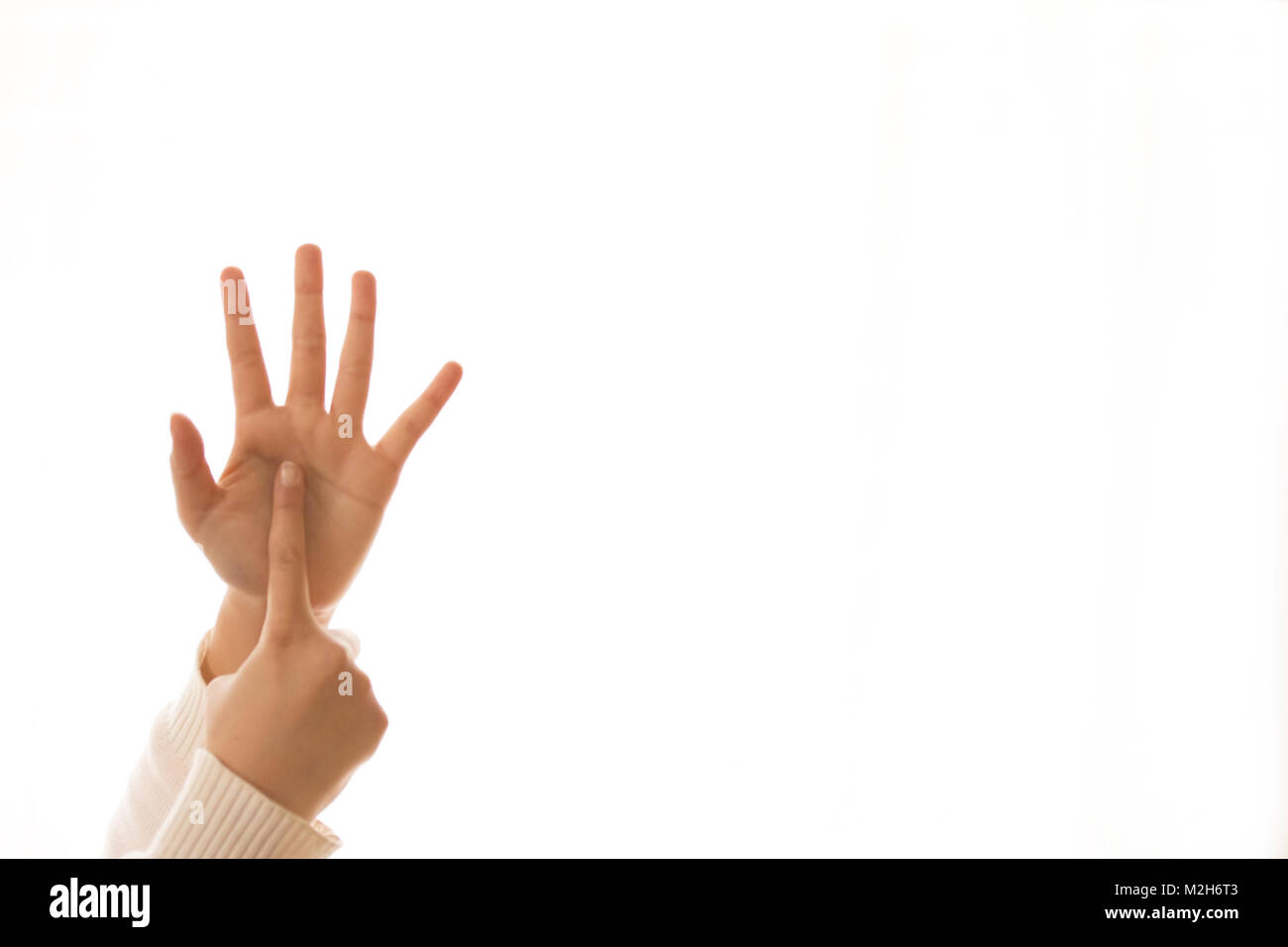 A hand sign indicating the number six Stock Photo - Alamy
