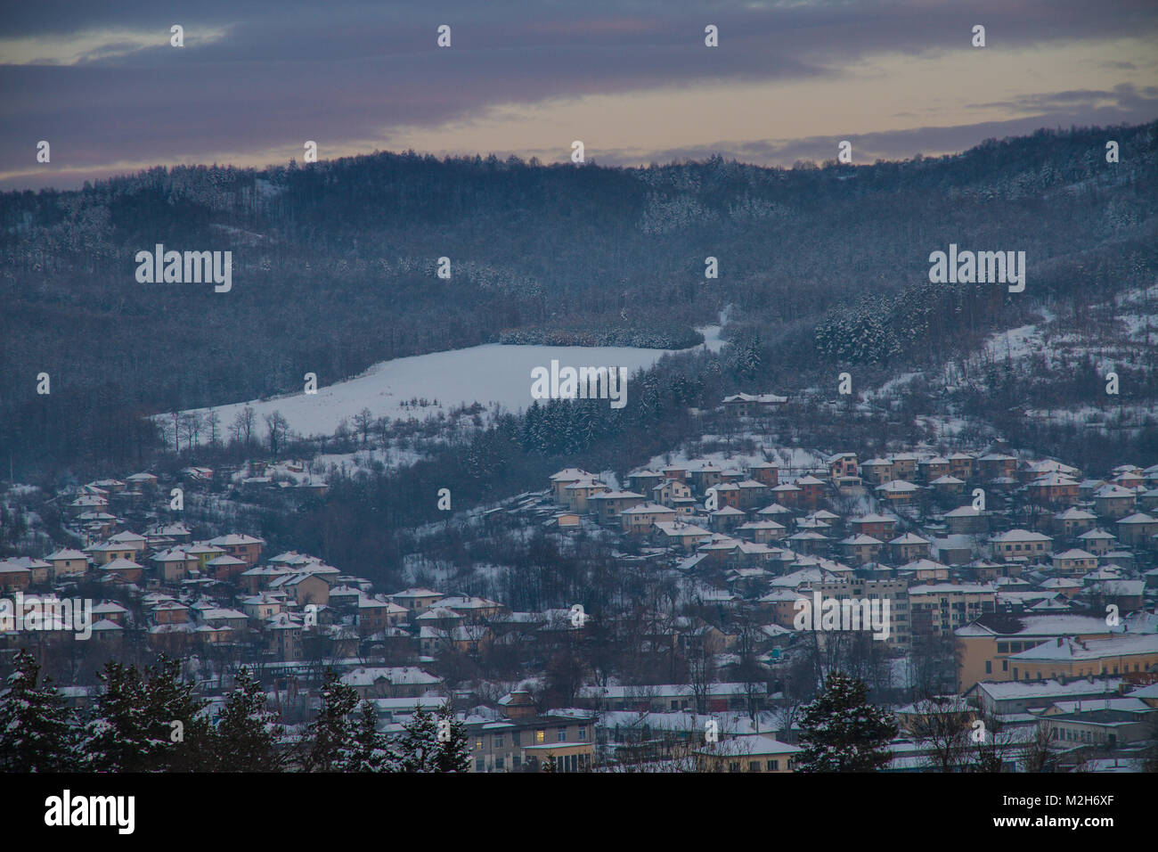 The village Tryavna in winter. Sunset Stock Photo - Alamy