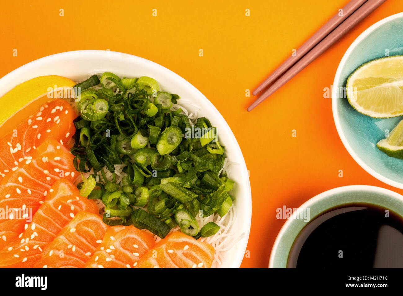 Hawaiian Poke bowl Of Salmon Sashimi With Rice Noodles And Spring ...