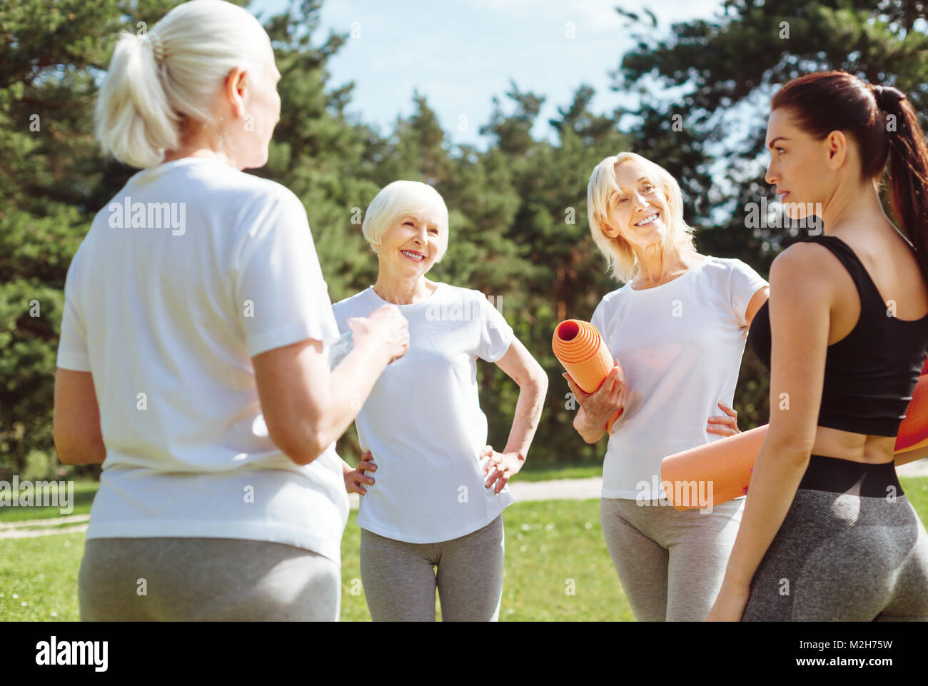 Happy positive women standing in the circle Stock Photo - Alamy