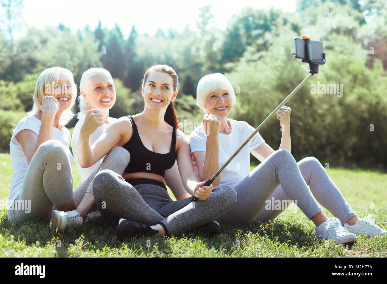 Happy delighted woman smiling to the camera Stock Photo - Alamy