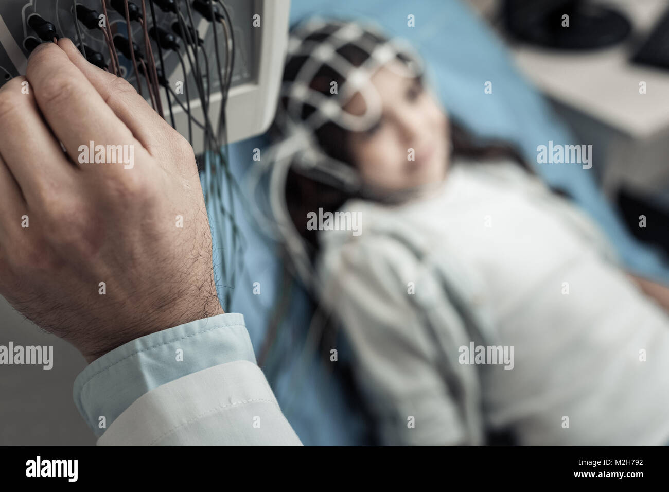 Professional smart doctor touching the wires Stock Photo - Alamy