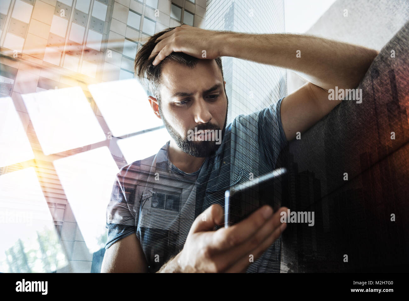 Worried man discovering unpleasant news when reading messages Stock ...