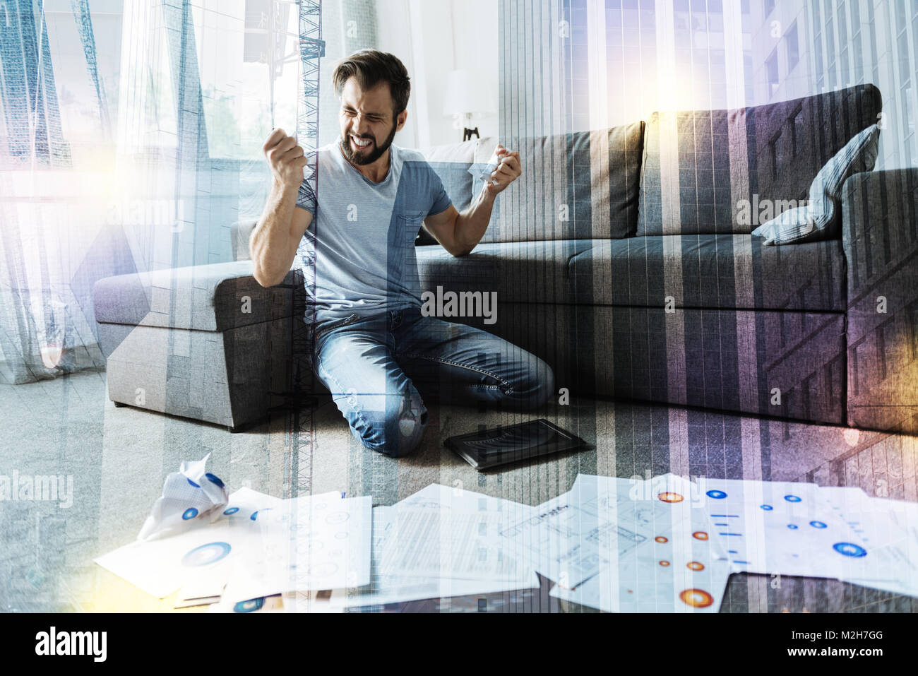 Furious man scrunching documents and feeling very angry Stock Photo - Alamy