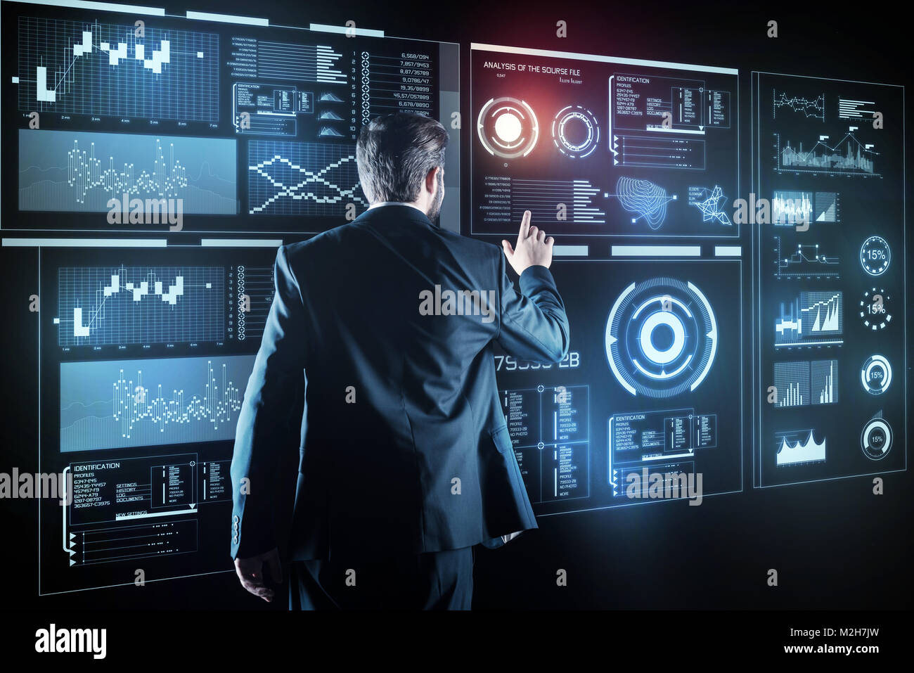 Clever programmer looking calm while touching the transparent screen ... Clever programmer looking calm while touching the transparent screen ...