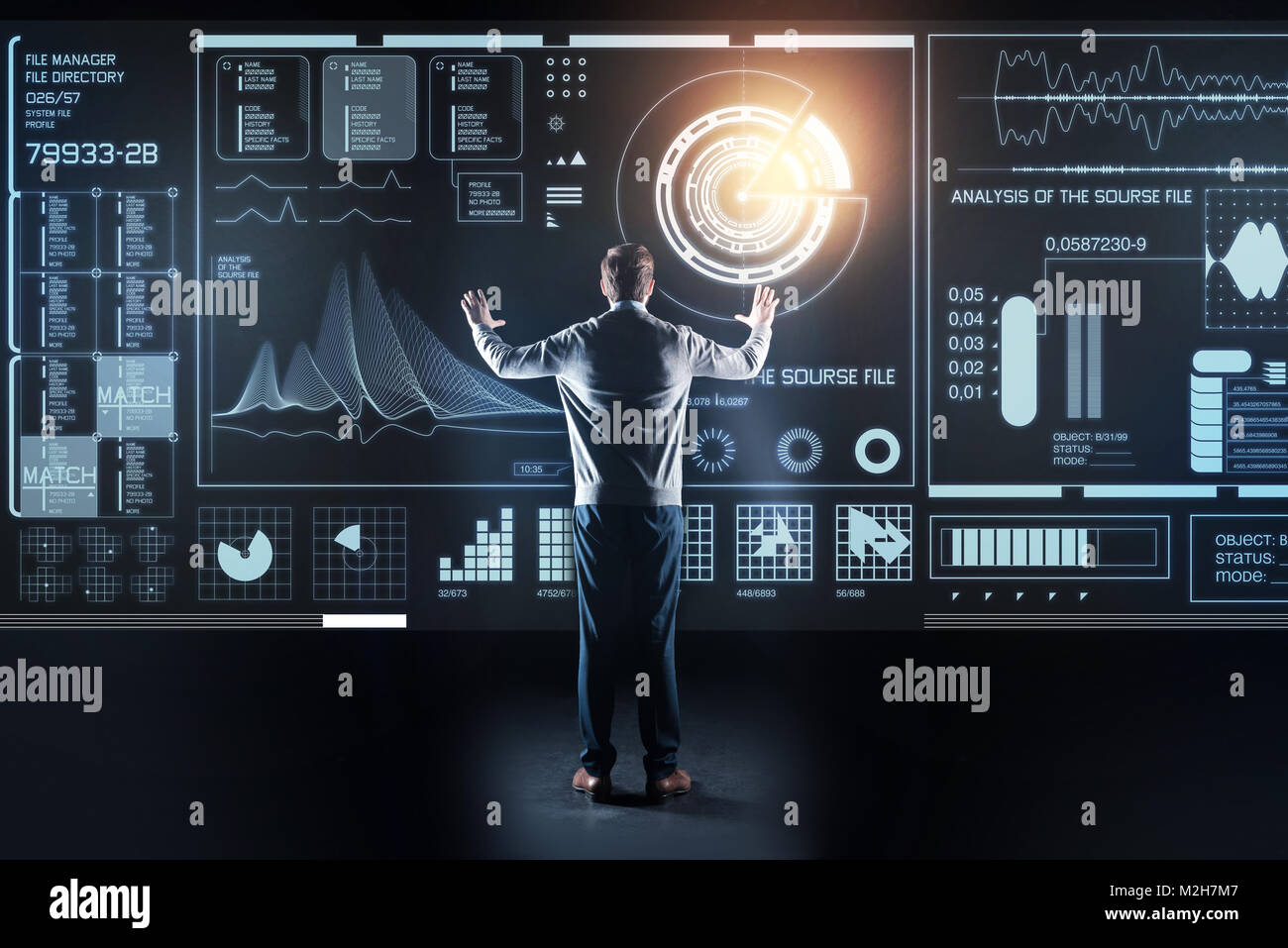 Experienced programmer standing with his hands up and looking at the ...