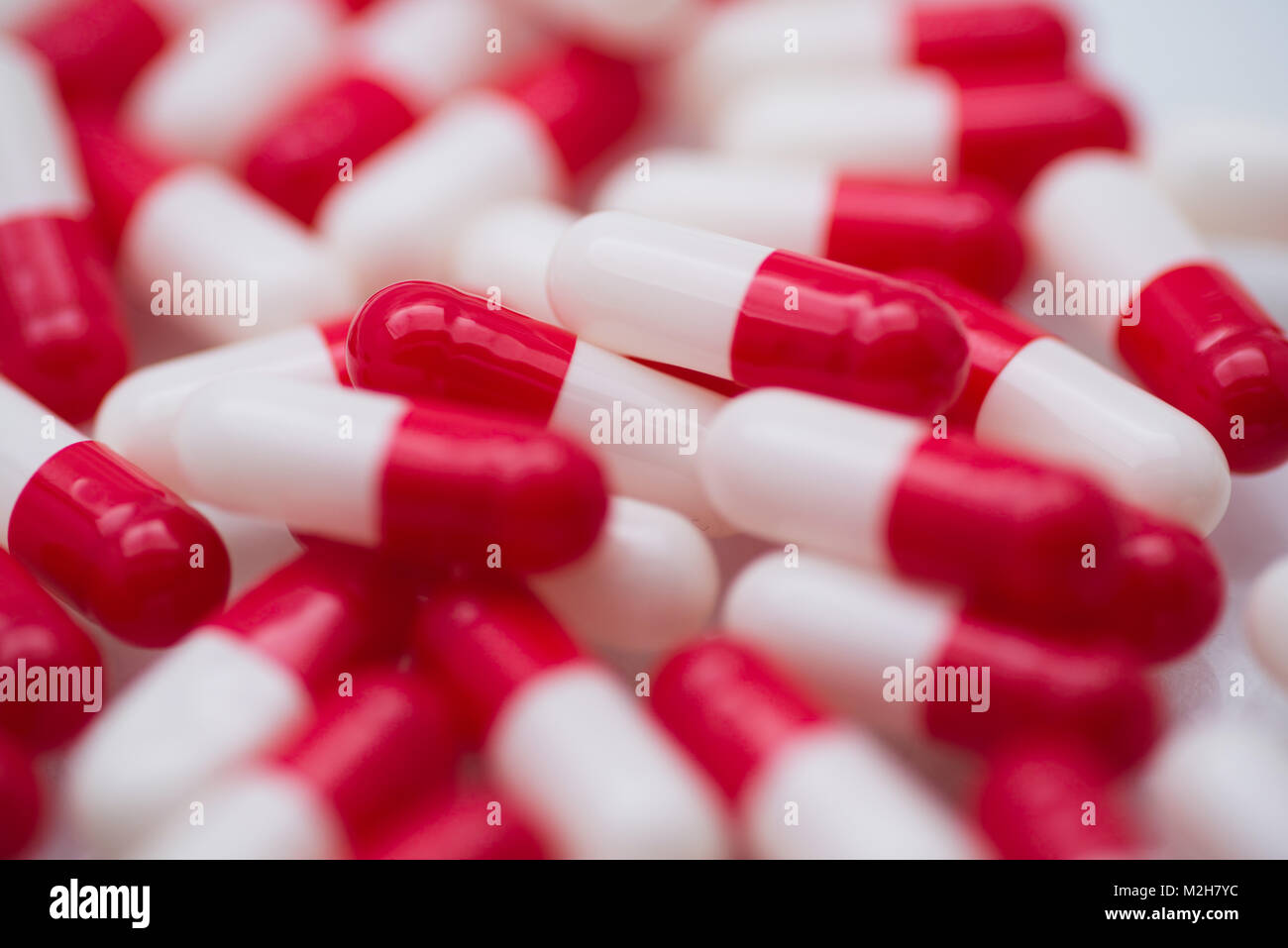 Close up of red and white capsule pills, pharmaceuticals, medicine ...
