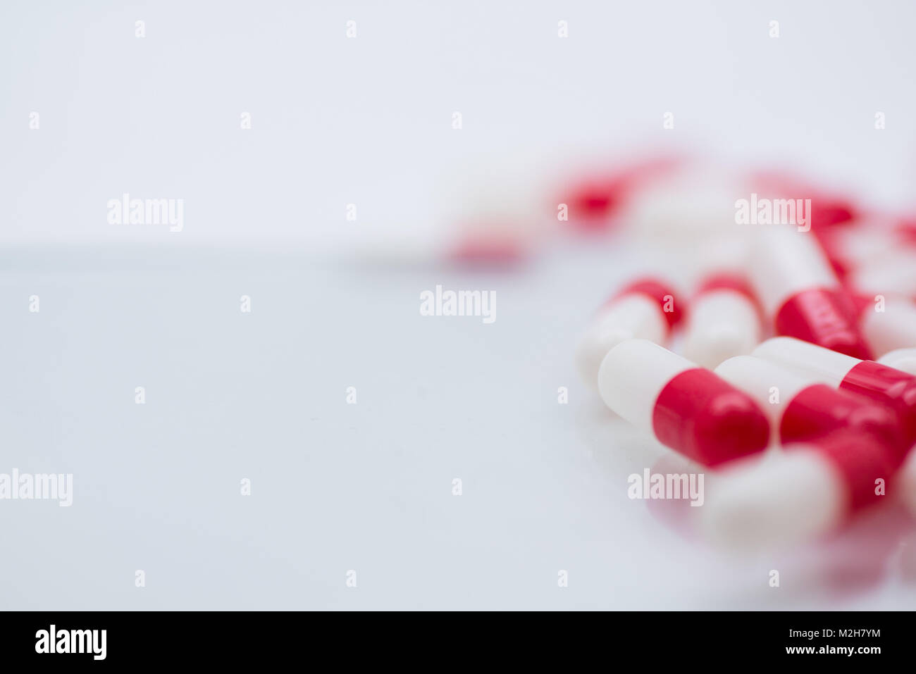 Close up of red and white capsule pills, pharmaceuticals, medicine ...
