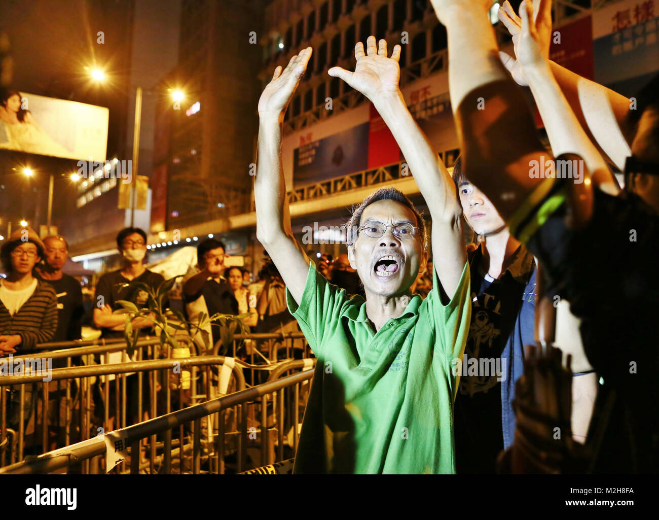 A man is furious and keeps charging the protestors before the police ...