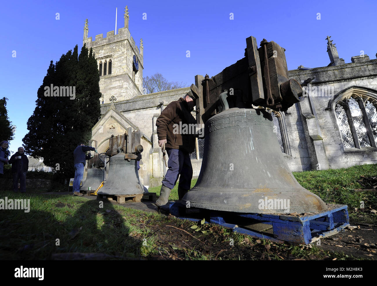 A team volunteers remove church bells hi-res stock photography and ...
