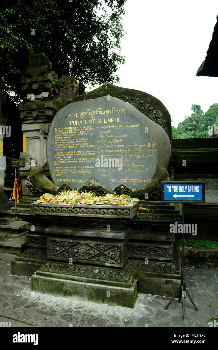Offerings on carved stone entrance Bahasa Bali Balinese Script Pura ...