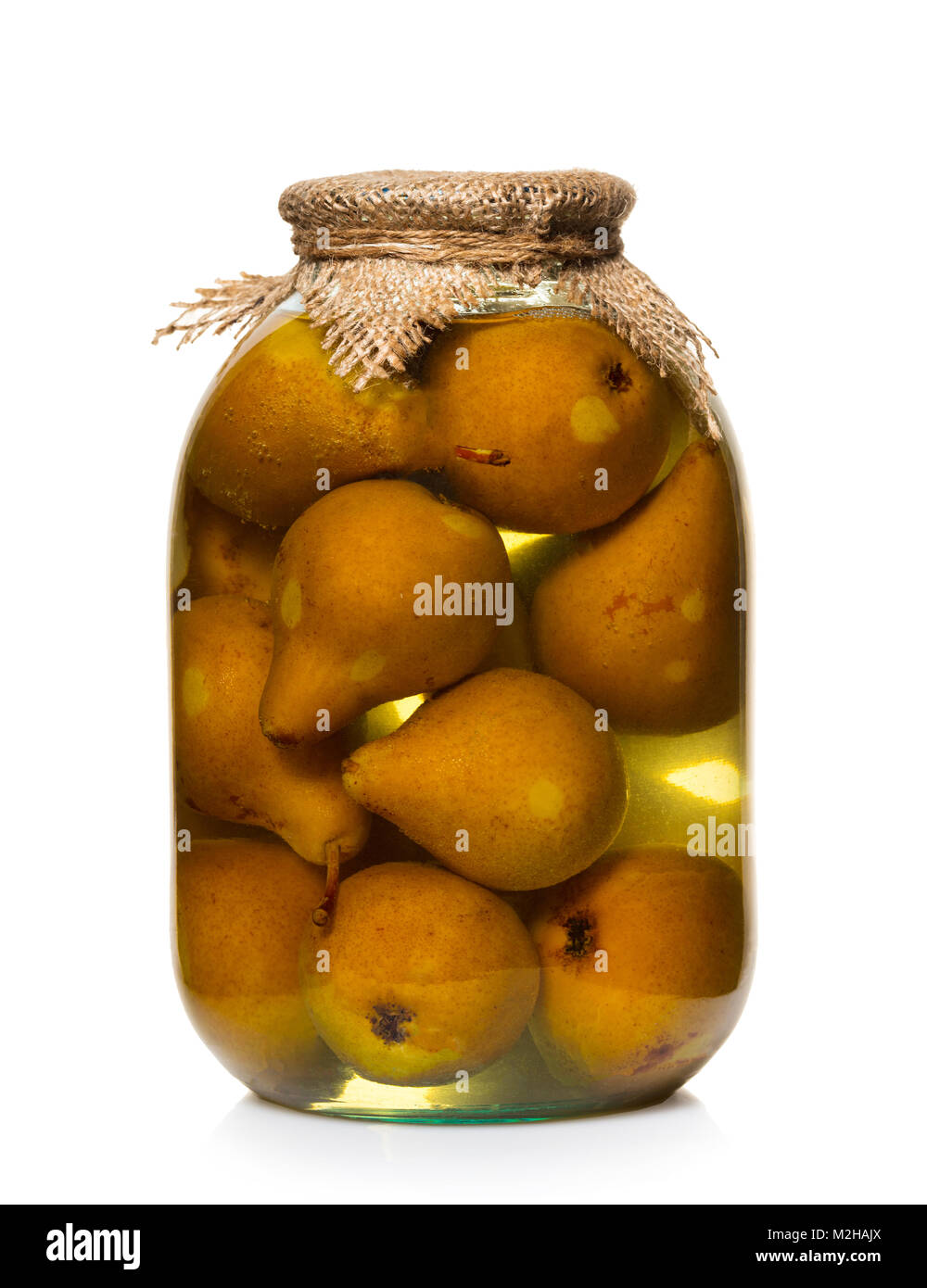 canned pears in a jar on white isolated background Stock Photo - Alamy