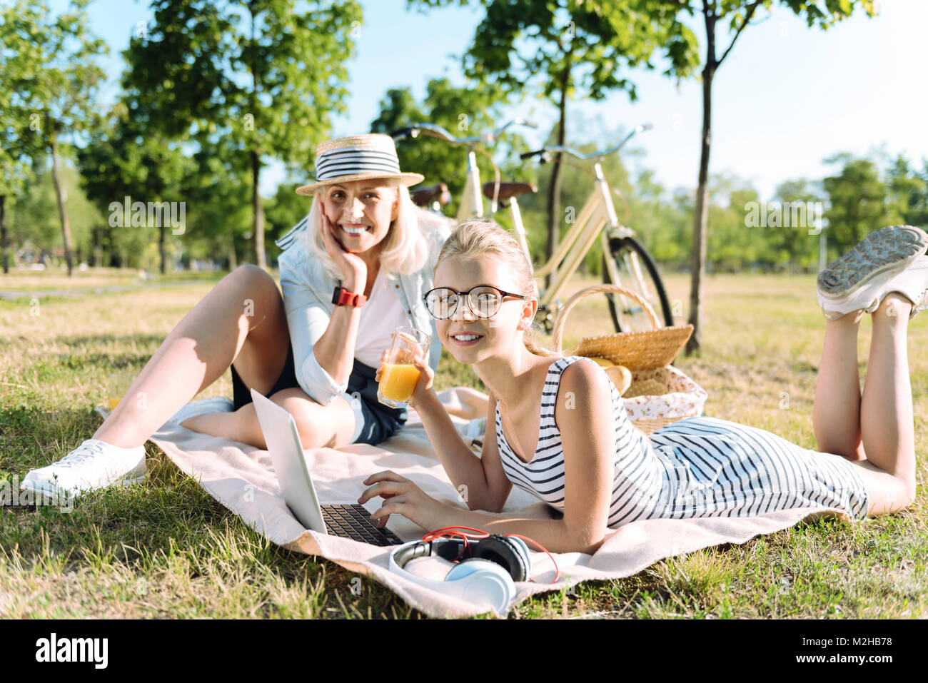 Positive smart girl typing on a laptop Stock Photo - Alamy