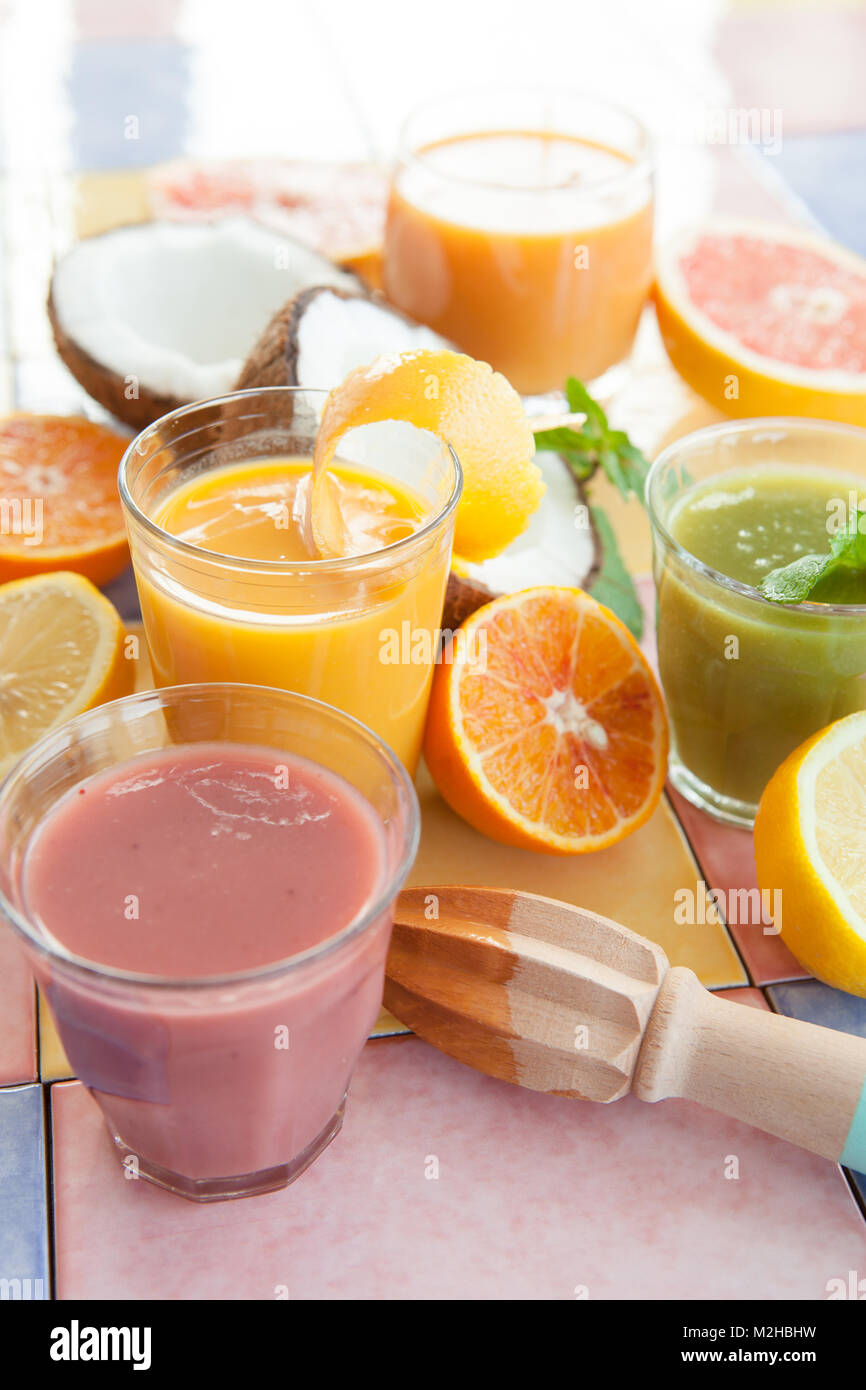 Variety of colorful smoothies and fresh fruits Stock Photo - Alamy