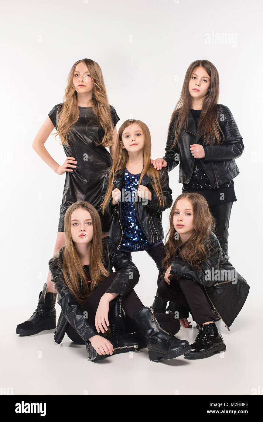 Studio portrait of young attractive caucasian teen girls posing at ...