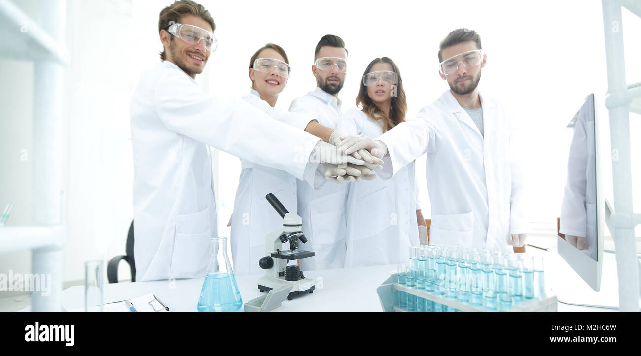 Scientists hands together hi-res stock photography and images - Alamy