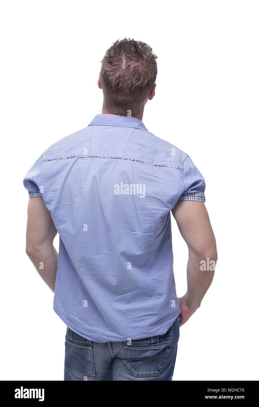 rear view. male with hands behind head and looking forward Stock Photo ...