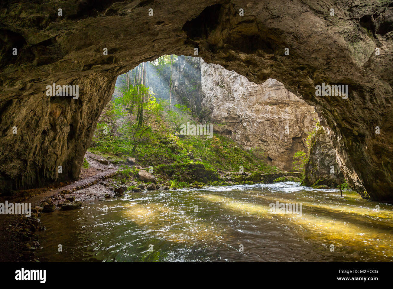 Natural tunnel and bridge in Rakov Skocjan Valley Stock Photo - Alamy