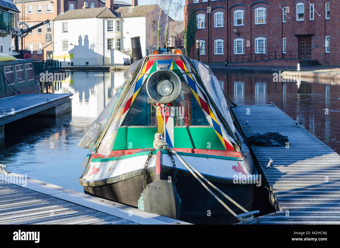 Colourful narrowboat moored at Cambrian Wharf on the canal network in ...
