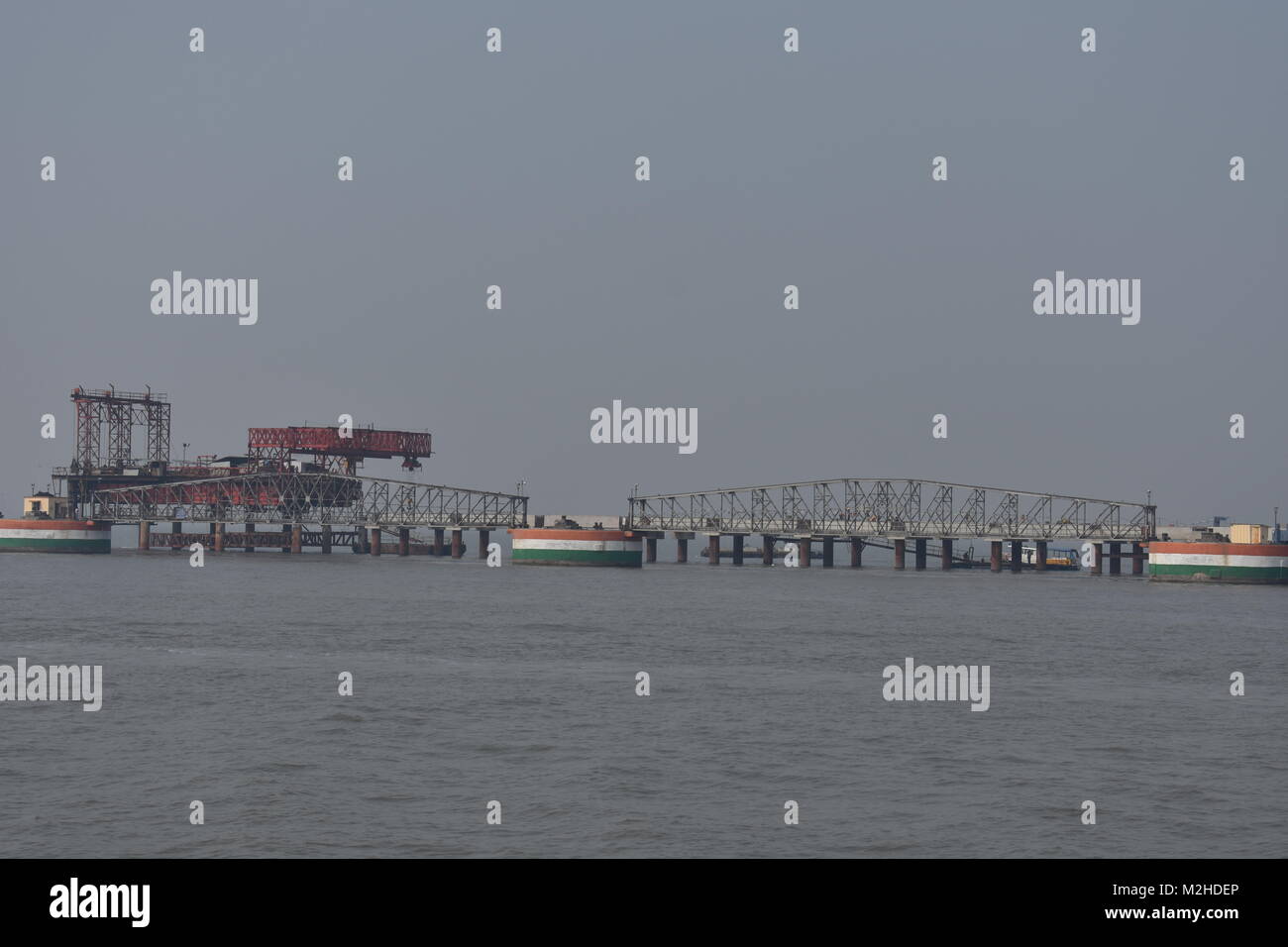 A view of a transmission way refinery plant at sea at background Stock ...