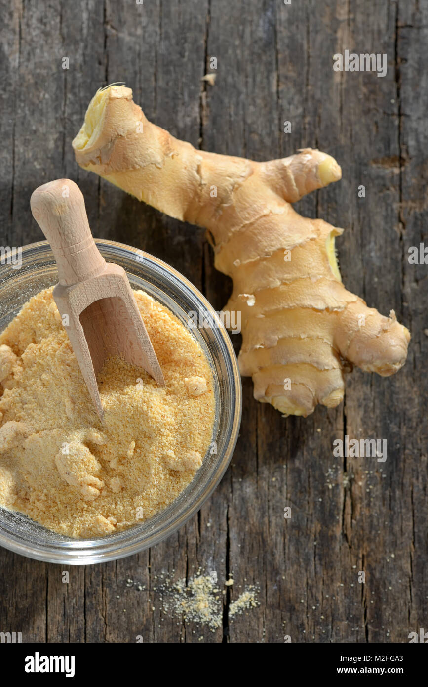 ginger root and ground ginger spice on wooden background Stock Photo ...