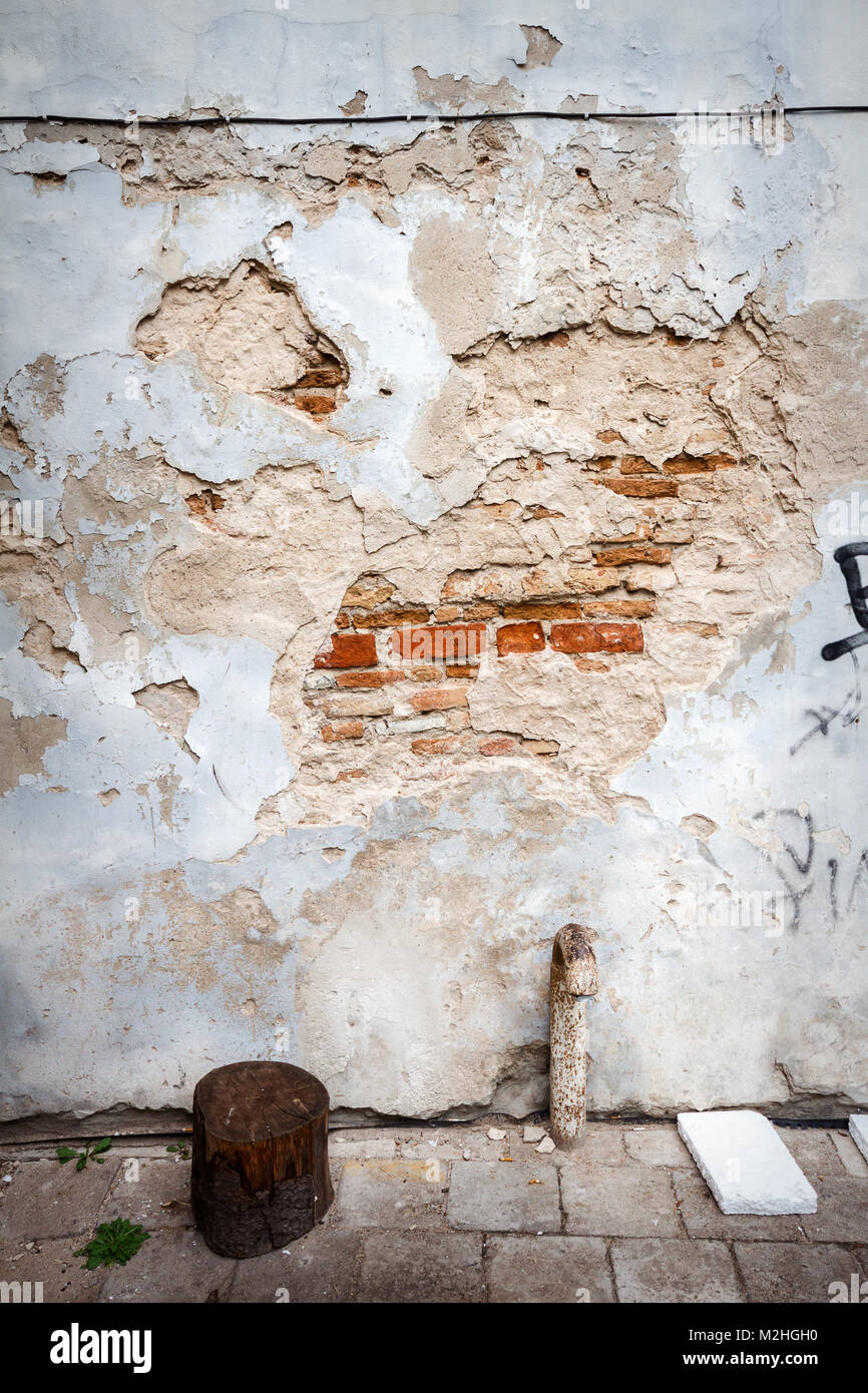 Old weathered wall of bricks and a ground Stock Photo - Alamy