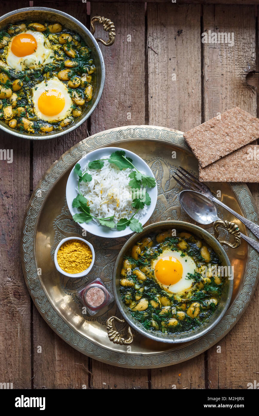 Baghali ghatogh - Iranian dish made with bean, dill, and Eggs Stock ...