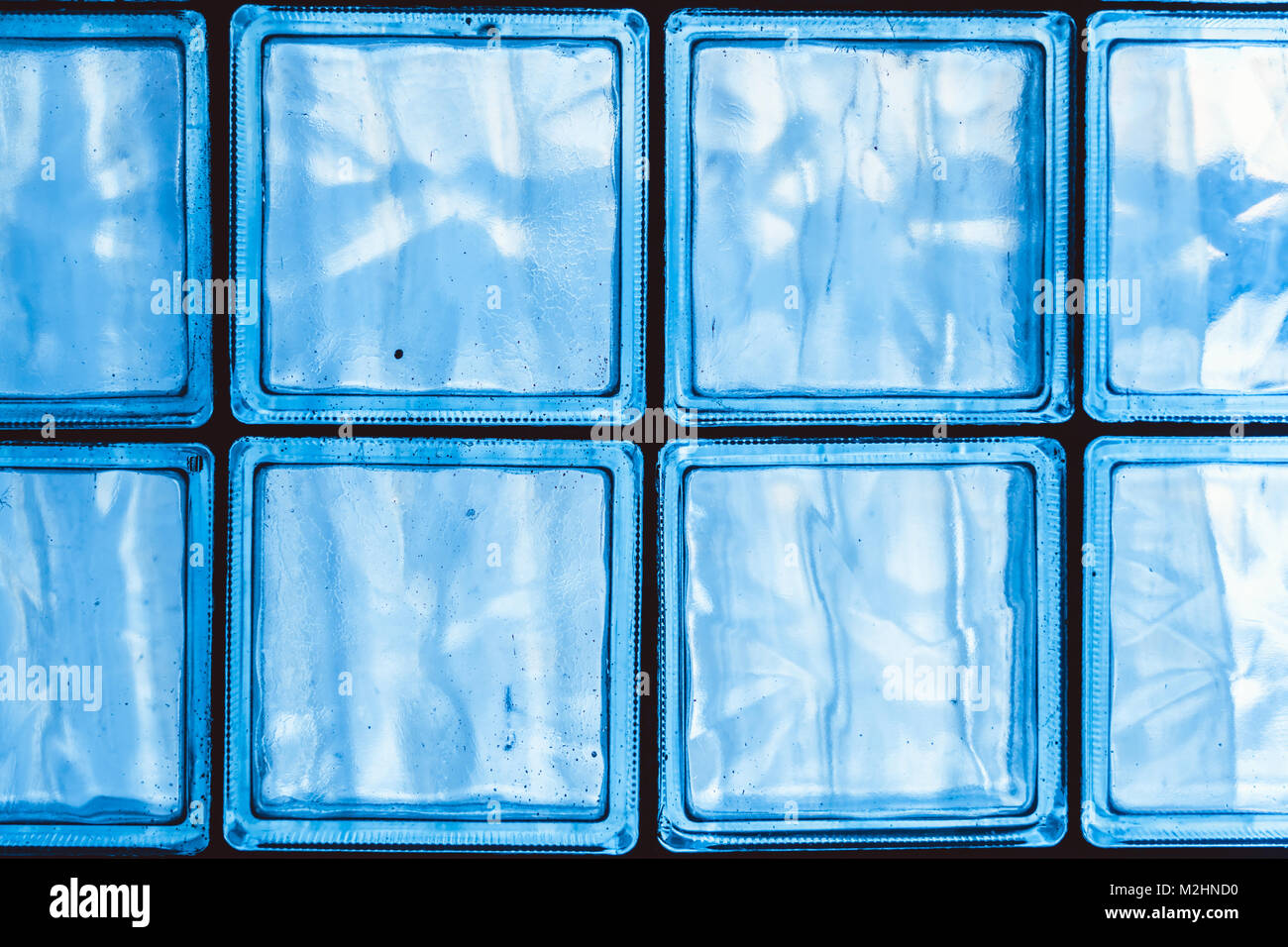 Wall of transparant glass tiles serving as colorful window wallpaper ...