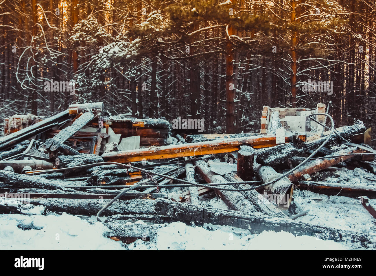 Burned wooden walls the house after the fire. Burnt old wooden building ...