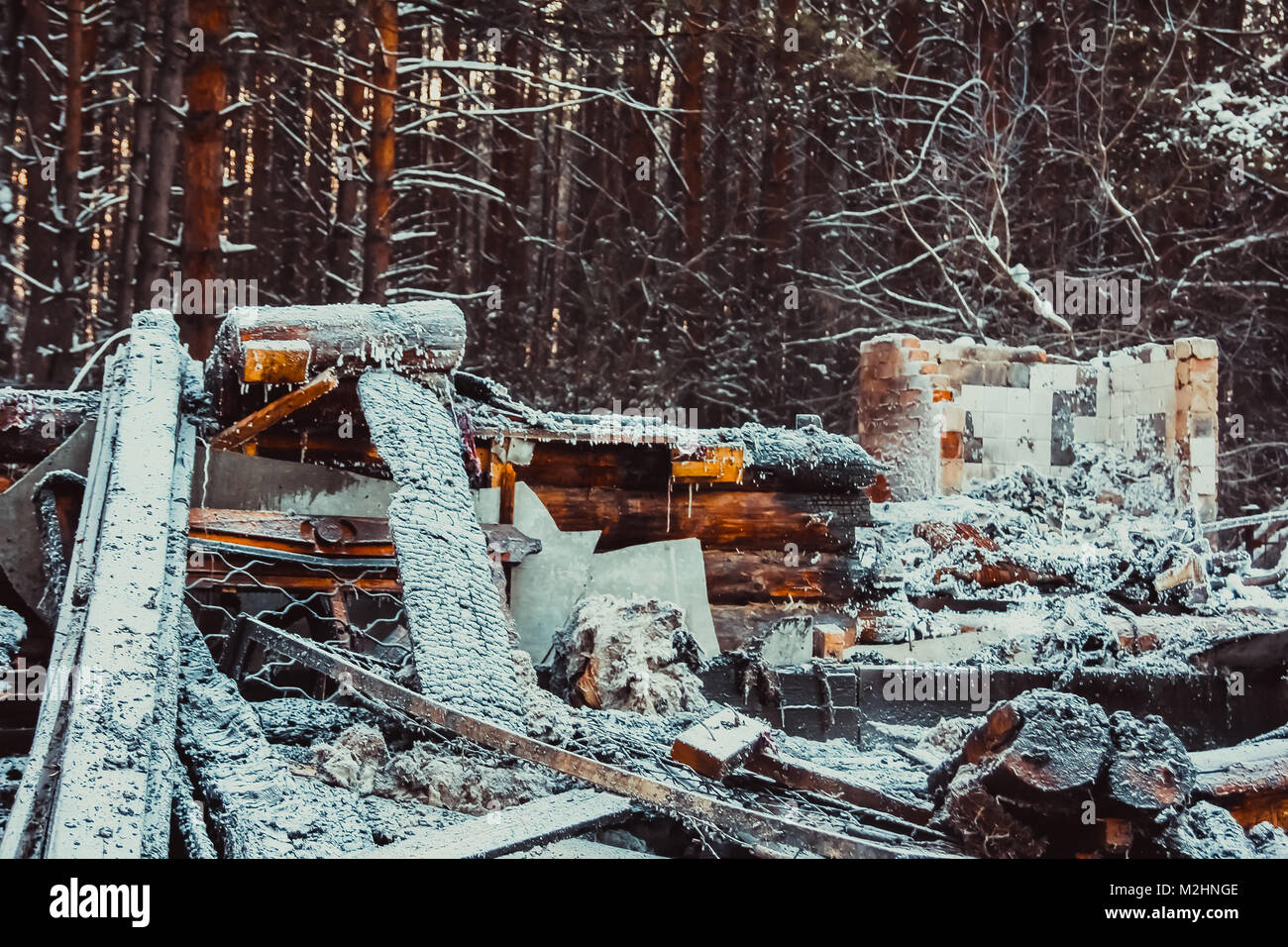 Burned wooden walls the house after the fire. Burnt old wooden building ...