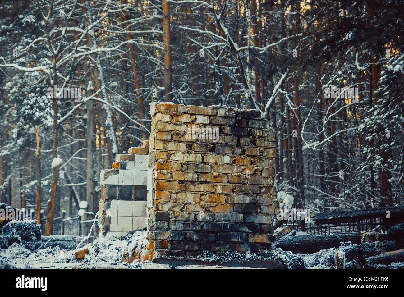 Burned wooden walls the house after the fire. Burnt old wooden building ...