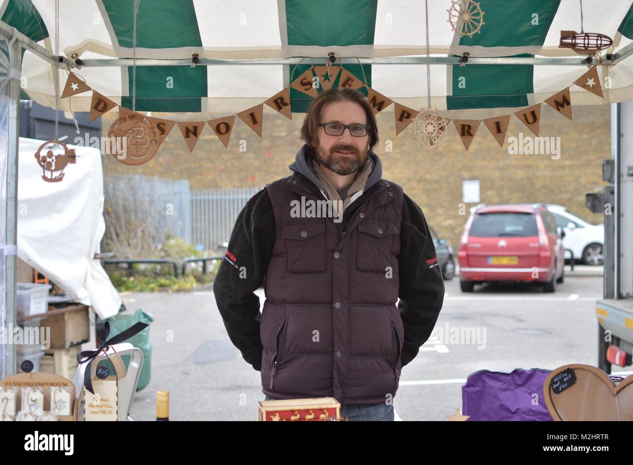 man at a market stall Stock Photo - Alamy