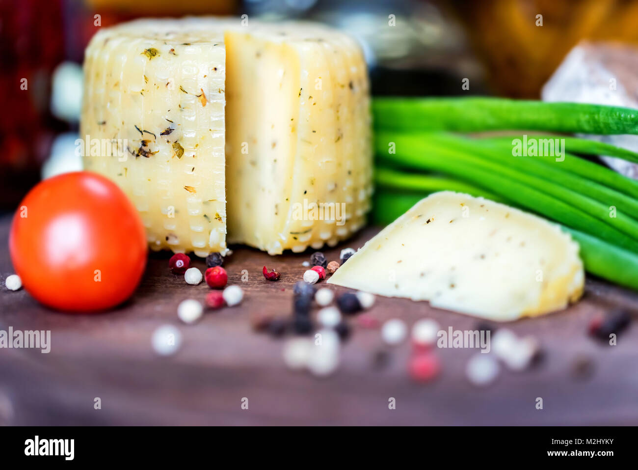 Rustic cheese with herbs, pepper and vegetables Stock Photo - Alamy